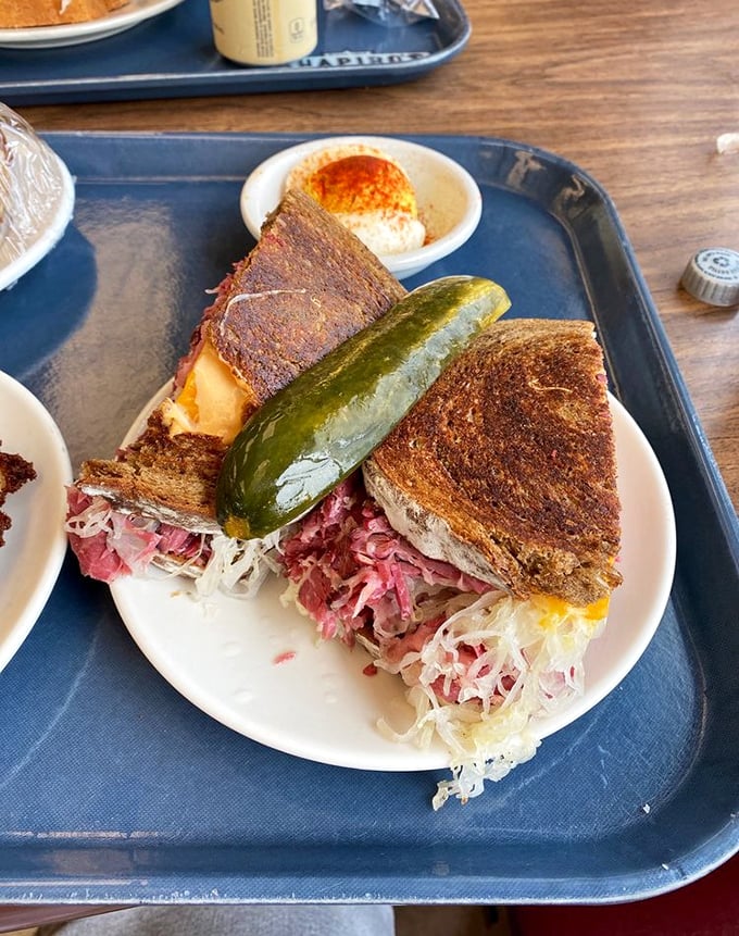 Behold the legendary Reuben in all its glory! Corned beef stacked higher than a Midwest snowdrift, with sauerkraut and Swiss creating the perfect harmony.