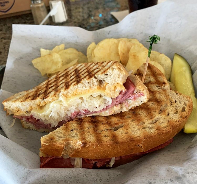 Behold the legendary Reuben in its natural habitat&mdash;perfectly grilled rye, sauerkraut peeking out, and a pickle standing guard. This is sandwich royalty.