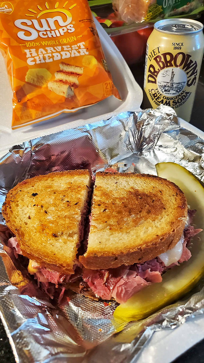 Behold the star attraction &ndash; layers of corned beef, sauerkraut, and Swiss cheese melting together in perfect harmony between golden rye.