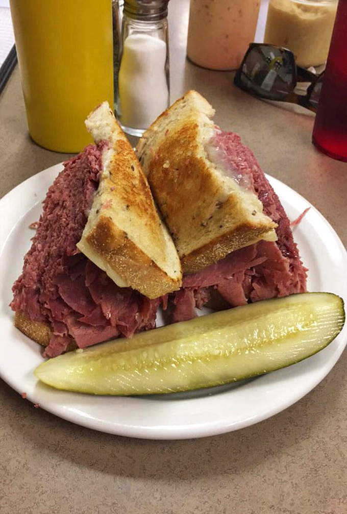 Behold the architectural marvel that is Slyman's corned beef sandwich. This isn't just lunch—it's a monument to excess that somehow maintains perfect balance.
