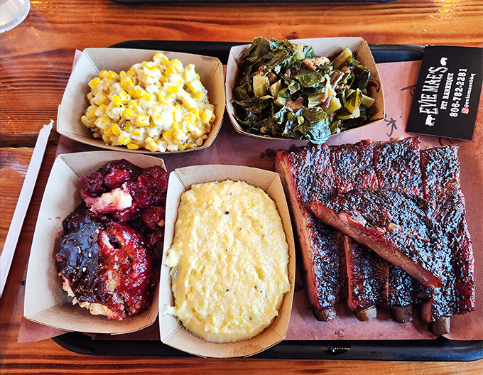 Heaven arrives on a tray: ribs with bark so perfect they should be in a museum, alongside sides that refuse to be overshadowed.