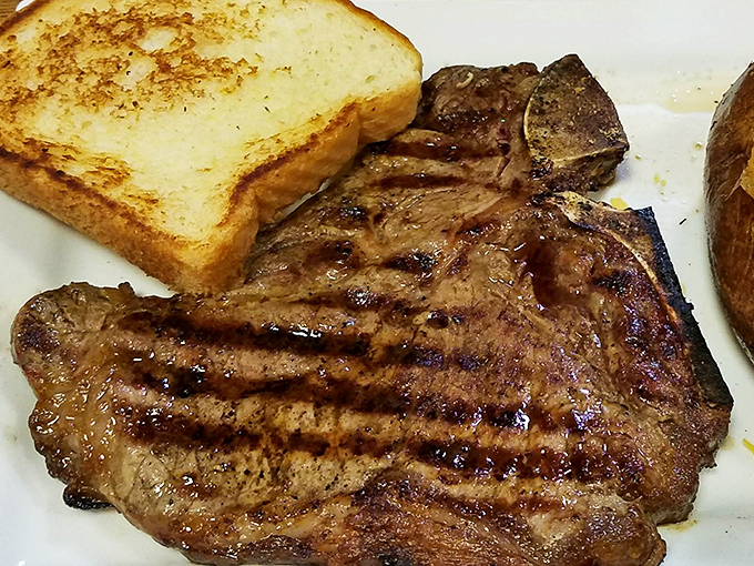 This isn't just a ribeye; it's a masterclass in simplicity. Perfectly charred exterior, juicy interior, and that buttery toast ready for cleanup duty.