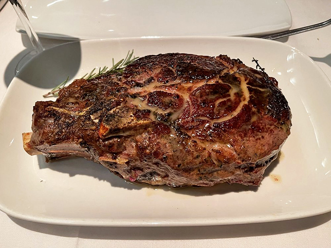 This bone-in ribeye isn't just a steak—it's a primal masterpiece with a crust that crackles like a campfire and interior as tender as a love song.