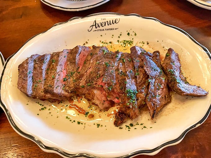 The ribeye arrives like a masterpiece, perfectly seared and sliced to showcase that rosy interior that makes steak lovers weak in the knees.