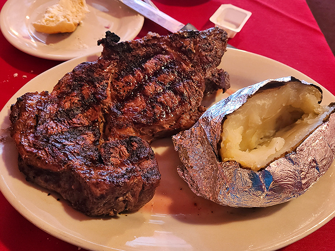 This isn't just a steak; it's a masterpiece with grill marks. The kind of ribeye that makes vegetarians question their life choices.