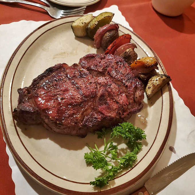 This isn't just a ribeye—it's a masterclass in the art of grilling. That perfect crust speaks of patience, tradition, and the magic that happens when beef meets oak fire.
