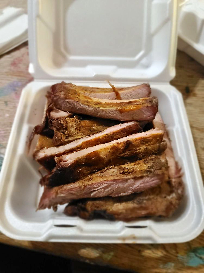 These ribs aren't just cooked&mdash;they're transformed. The perfect pink smoke ring tells the story of patience and expertise.