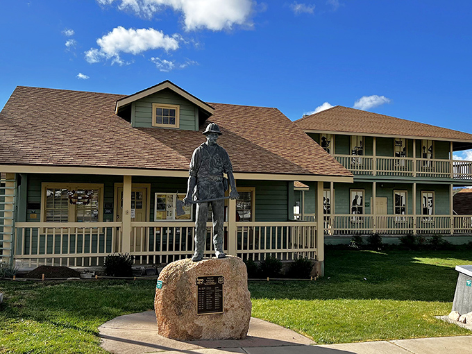 The statue stands guard outside the Rim Country Museum, silently telling stories of cowboys and pioneers who weren't checking their phones every five minutes.