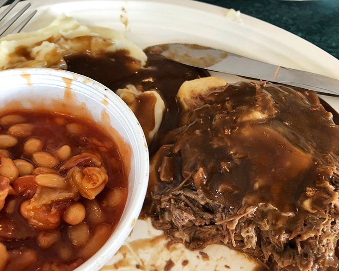 Behold the star attraction: roast beef swimming in gravy so rich it could apply for its own tax bracket, with beans that aren't playing a supporting role.