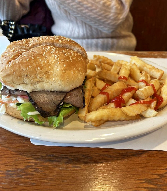 This roast beef sandwich isn't just lunch&mdash;it's architecture. Perfectly stacked layers of beef, fresh veggies, and those golden fries deserve their own blueprint.