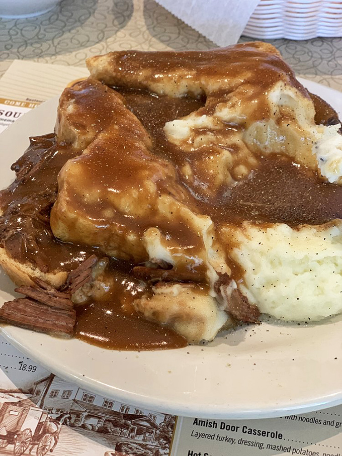 This isn't just roast beef&mdash;it's a gravy waterfall cascading over mashed potato mountains. Comfort food architecture at its finest.