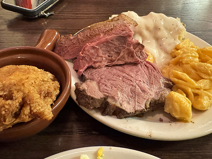 Behold the star attraction: perfectly pink roast beef alongside creamy mashed potatoes and mac & cheese&mdash;a holy trinity of comfort that makes grown adults weak in the knees.