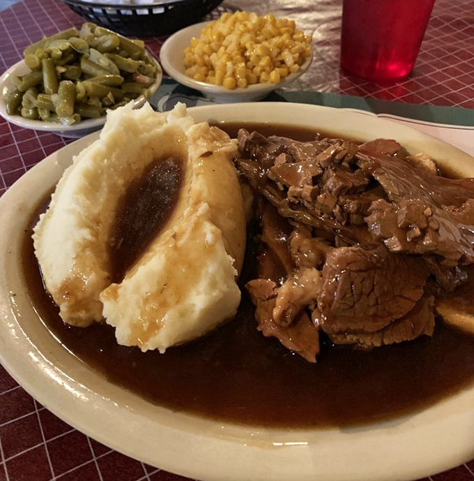 Roast beef that falls apart at the mere suggestion of a fork, surrounded by mashed potatoes practically begging for that river of gravy.