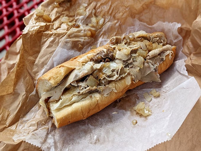 A symphony of tender pork and caramelized onions on that magical Philly roll&mdash;proof that Pat's mastery extends beyond the cheesesteak realm.