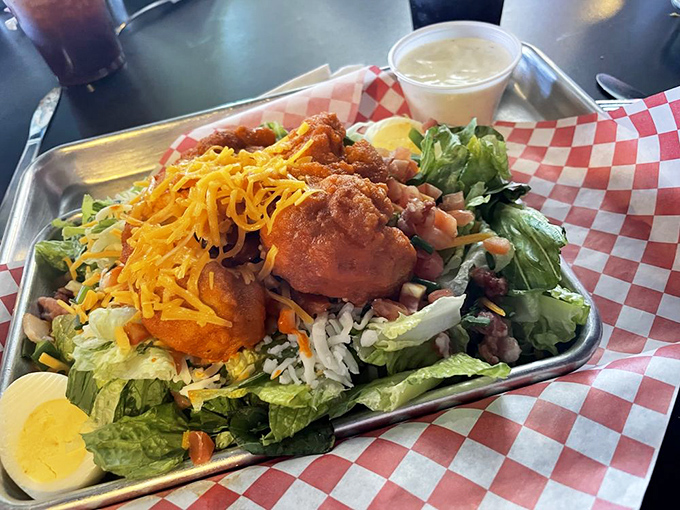 This Buffalo Chicken Salad isn't just a meal, it's an event—crisp greens playing the perfect supporting role to that spicy, crispy chicken star.