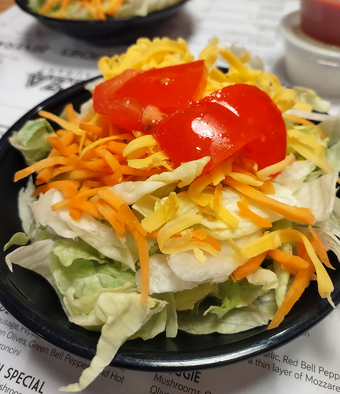 This isn't just a salad; it's a Midwestern handshake – crisp, honest, and topped with that signature shredded cheese that says "welcome home."