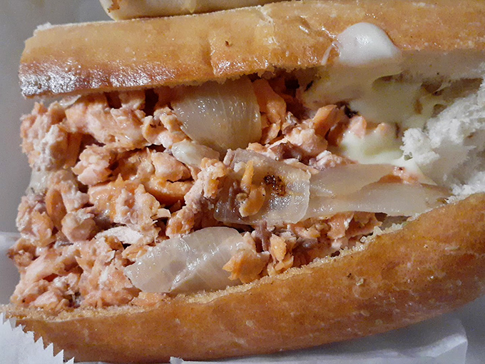 This salmon cheesesteak isn't playing by Philadelphia's rules, but with caramelized onions and melty cheese, it's breaking them beautifully.