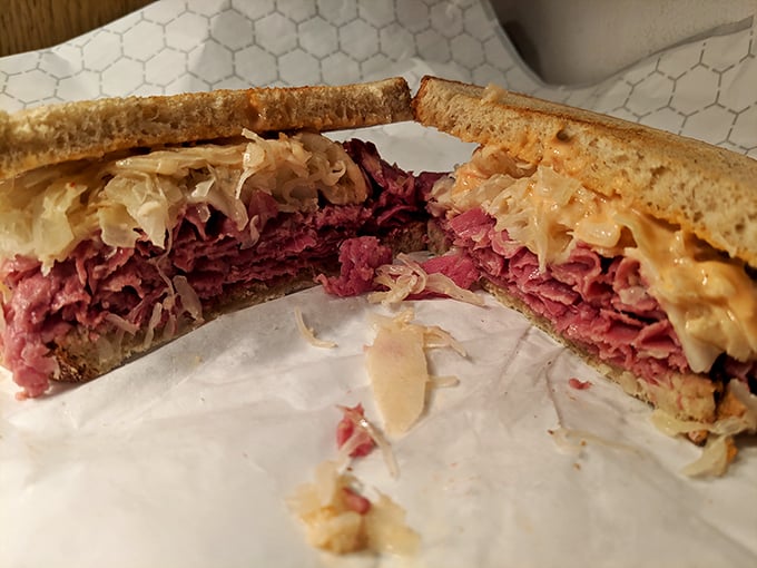 This isn't just a sandwich; it's a masterpiece of corned beef architecture with the perfect meat-to-sauerkraut ratio. Poetry between bread.