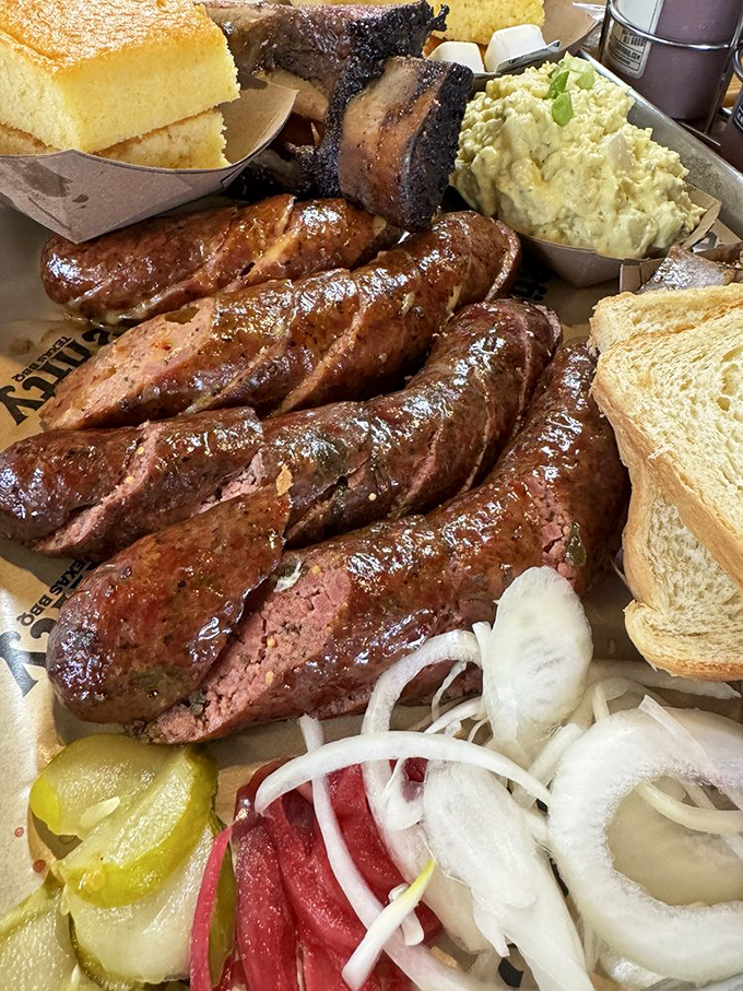 These sausages aren't just food; they're edible art. The glistening casing snaps like the world's most satisfying bubble wrap, revealing juicy, spiced perfection.