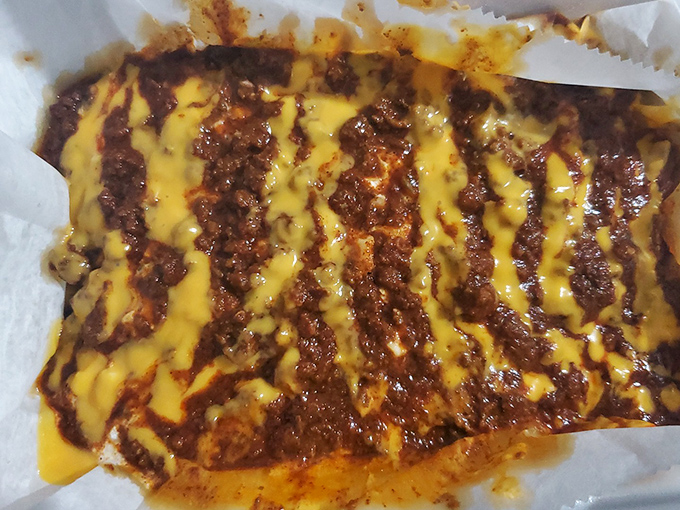 The legendary Scrambled Dog: where chili, cheese, and hot dog unite in a glorious mess that requires a fork and absolutely zero dignity.mble dog