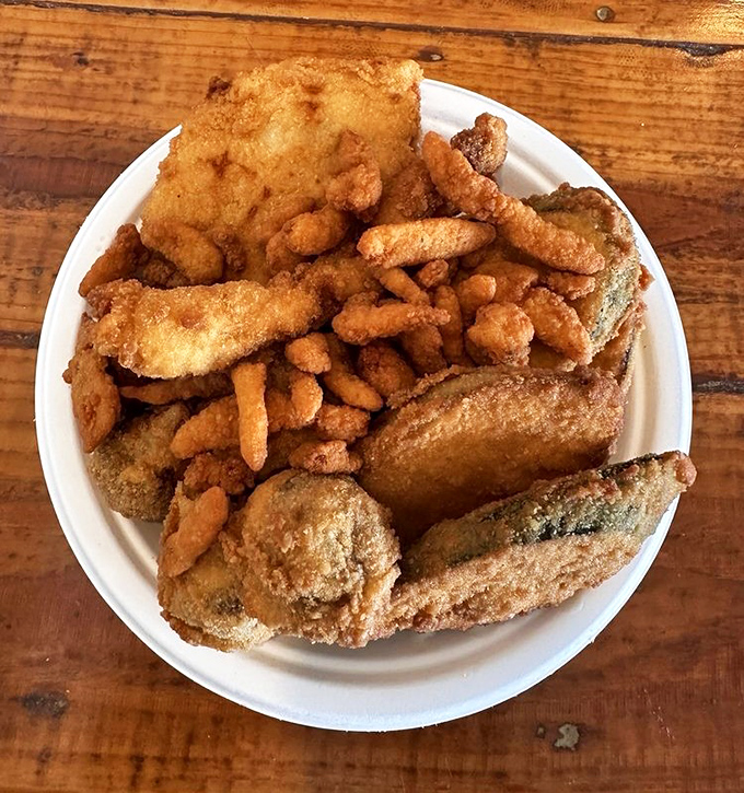 Golden-fried perfection that would make coastal snobs do a double-take. This platter isn't just food; it's an edible argument against geography.