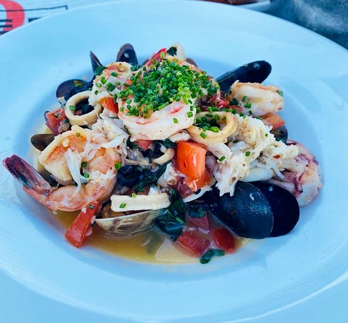 A symphony of seafood that Mozart would envy. Tender calamari, plump shrimp, and fresh mussels harmonize in a broth that deserves its own standing ovation.