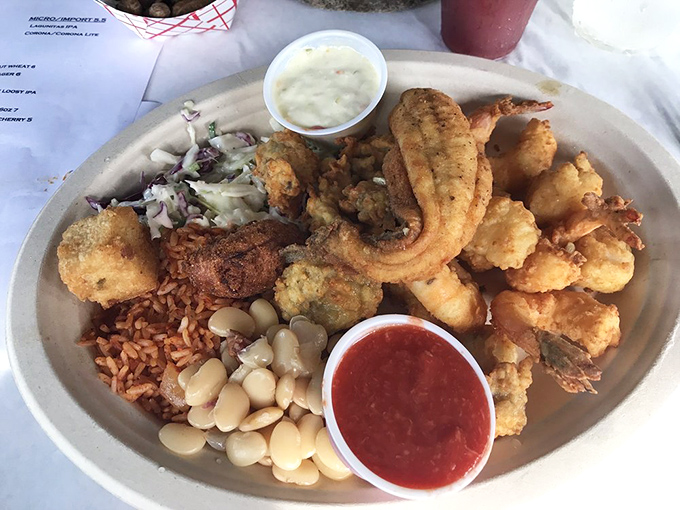 This isn't just a seafood platter &ndash; it's a Lowcountry love letter featuring golden fried treasures, red rice, and lima beans that would make any grandma proud.