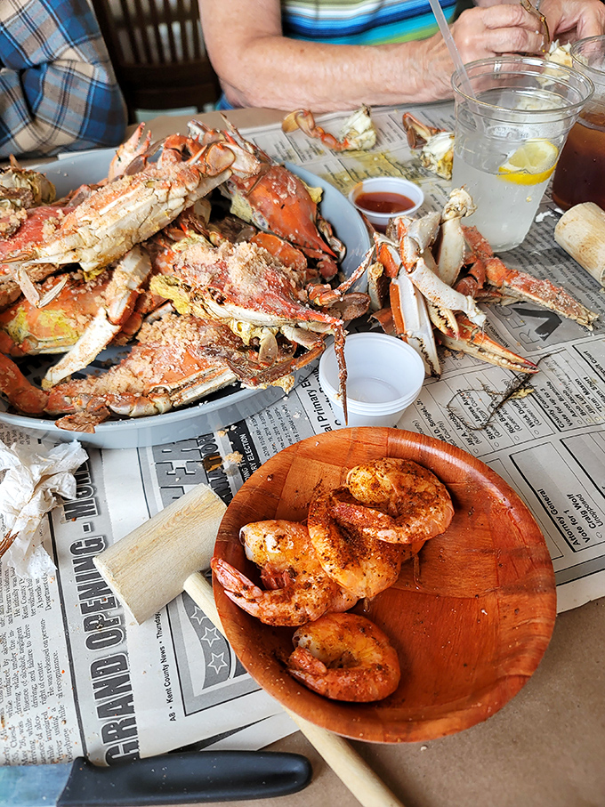 This isn't just dinner; it's a glorious archaeological dig for sweet crabmeat. The newspaper underneath will capture history (and butter) in equal measure.