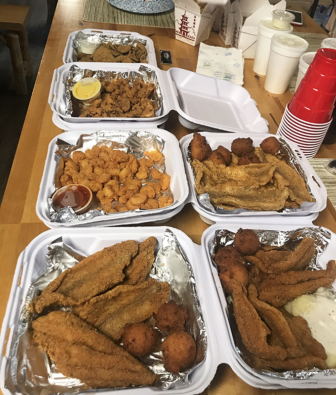 This isn't a fancy plating situation—it's a "we need more trays because there's so much delicious food" situation. Southern hospitality in takeout form.