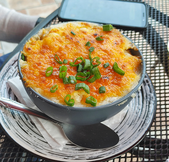 This Shepherd's Pie isn't just comfort food; it's a bubbling masterpiece topped with melted cheese and green onions that whisper, "Take a nap after."