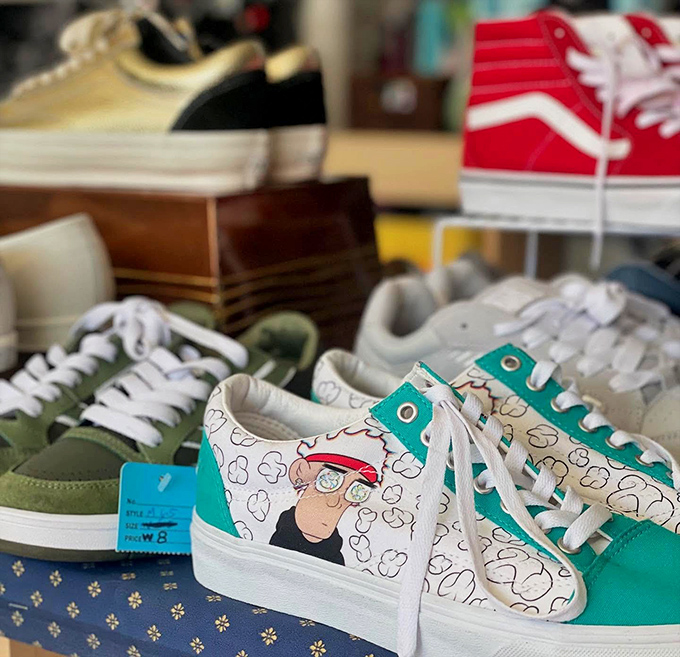 These aren't just sneakers; they're personality statements waiting for the right feet. That cartoon-adorned pair is practically begging for a second chance.
