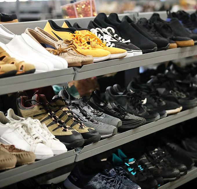 Footwear fantasies come alive in neat rows. That pair of barely-worn yellow sneakers might just be your next conversation starter at the neighborhood barbecue.