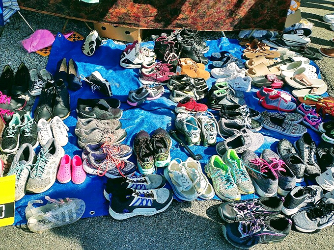 Sunday morning shoe shopping reimagined! Like Cinderella's fairy godmother went wild, this blue tarp displays footwear for every possible Pennsylvania adventure.