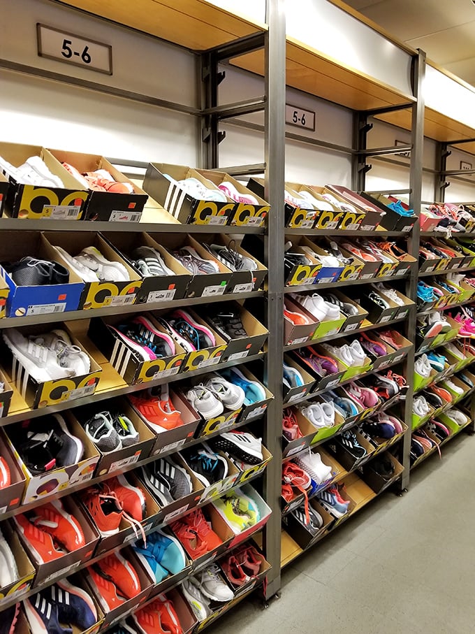 Sneaker heaven exists, and it's organized by size! This athletic footwear display is where wallets open and closet space disappears.
