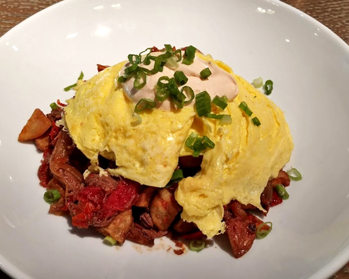 The legendary short rib hash &ndash; where tender meat meets crispy potatoes under a perfect egg. This is breakfast nirvana, folks.