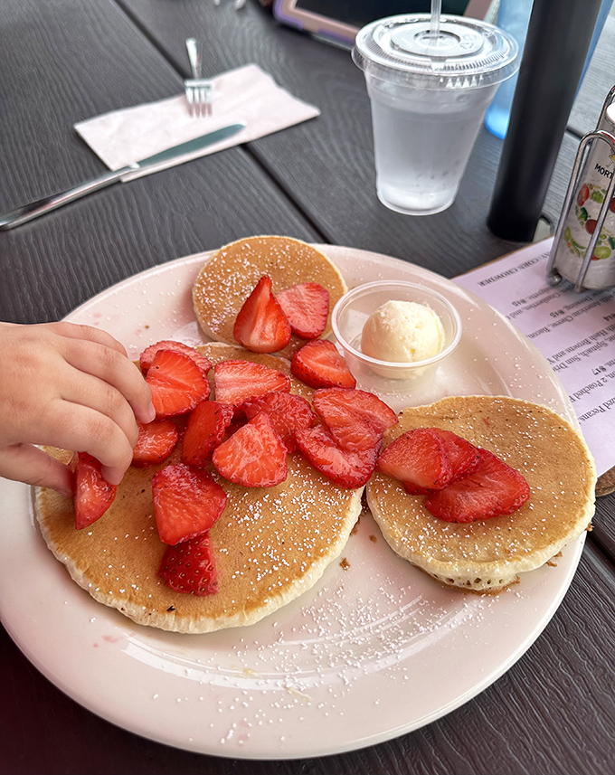 These golden pancakes topped with fresh strawberries aren't just breakfast &ndash; they're edible sunshine that makes you forget what day of the week it is.