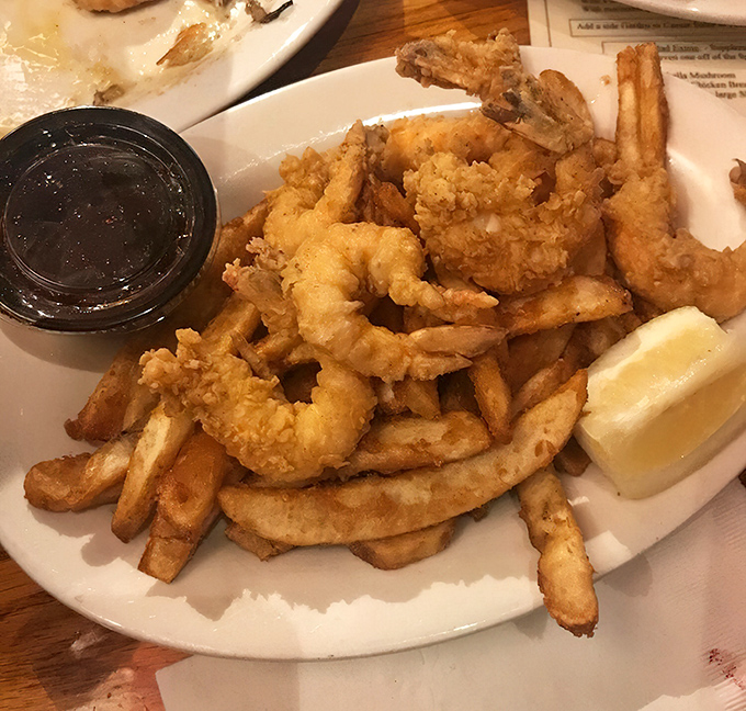 The star attraction arrives: golden-battered shrimp nestled among perfectly crisp fries &ndash; a combination that's sparked more joy than Marie Kondo ever could.