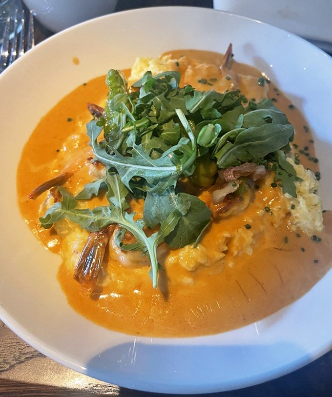 Behold the star attraction: shrimp and grits that would make a Southerner weep with joy, topped with peppery arugula for that perfect bite.