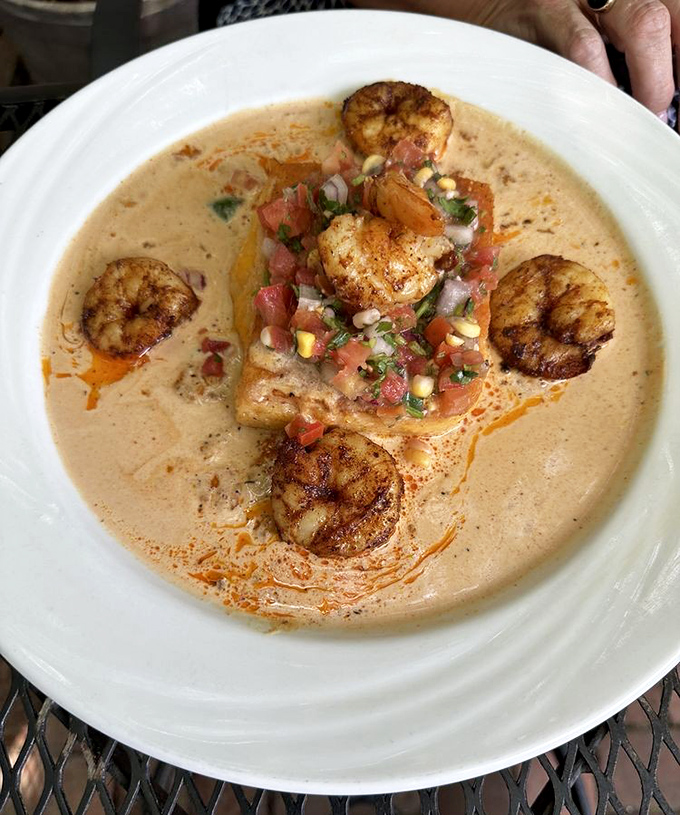 Shrimp and grits that could make a Southerner weep with joy&mdash;perfectly seared shrimp swimming in creamy heaven with fresh pico de gallo.