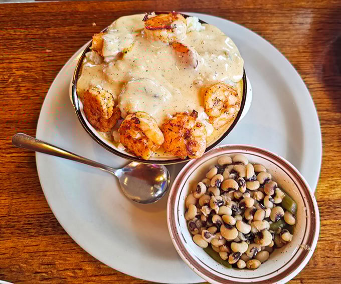 The shrimp and grits that turned skeptics into believers – creamy, smoky perfection that dreams are made of.