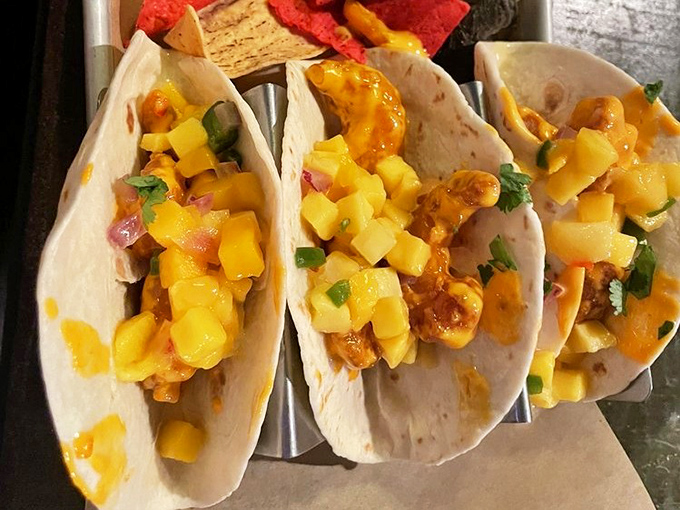 These shrimp tacos arrive looking like sunshine on a plate, with mango salsa that could make a grown person weep.