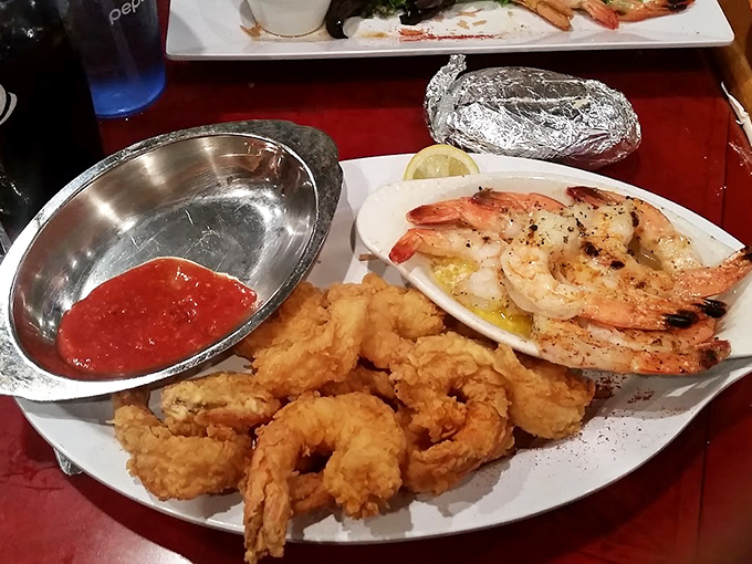 Golden-fried treasures alongside buttery shrimp that look like they just had a spa day. This plate is the seafood equivalent of hitting the lottery.
