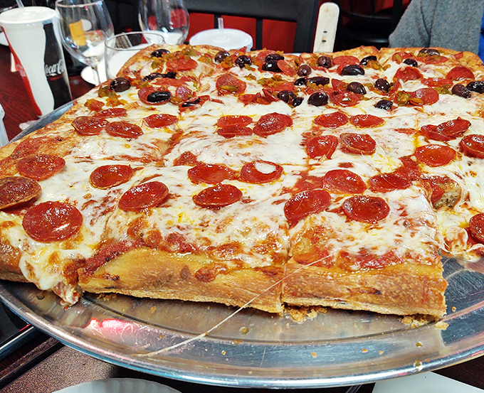 The star of the show: a Sicilian pizza with pepperoni and olives that makes you question why you ever settled for lesser pies.