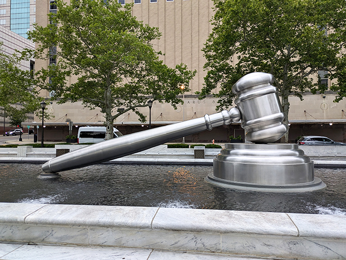 Side view splendor! The gavel's handle stretches dramatically across the water, creating a perfect photo op for visitors with a sense of judicial humor.