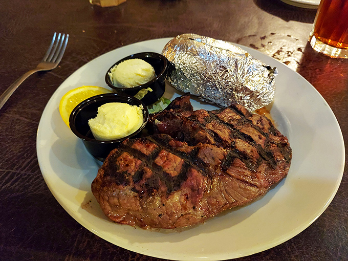 This isn't just a steak; it's a masterclass in simplicity. Perfect grill marks, butter-soft texture, and sides that know their supporting role.