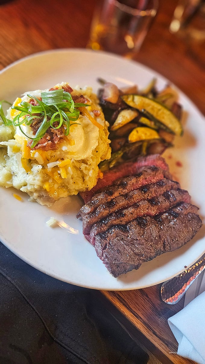 This isn't just a steak &ndash; it's a masterpiece of meat, accompanied by a loaded potato that's practically begging to be your side hustle.