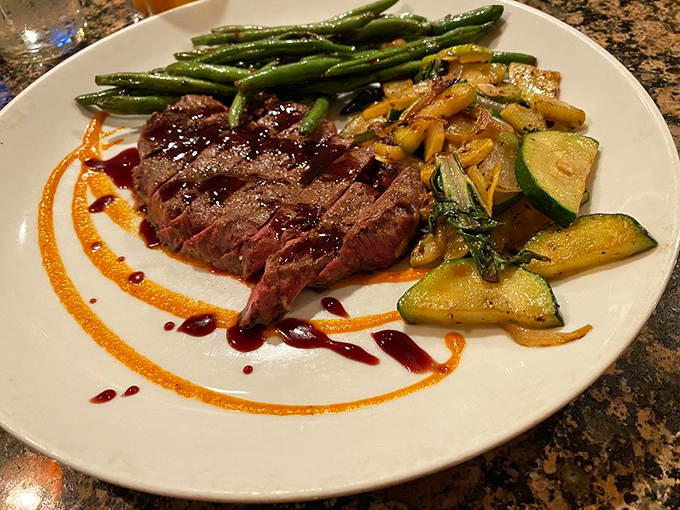 This isn't just dinner&mdash;it's edible artwork. The perfectly seared sirloin with colorful vegetables and artful sauce drizzles proves eating with your eyes comes first.