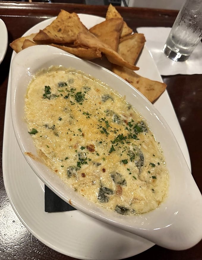 The bubbling crab dip arrives with perfectly golden triangles of flatbread. Like a warm jacuzzi for seafood, this creamy concoction might just ruin all other appetizers for you forever.