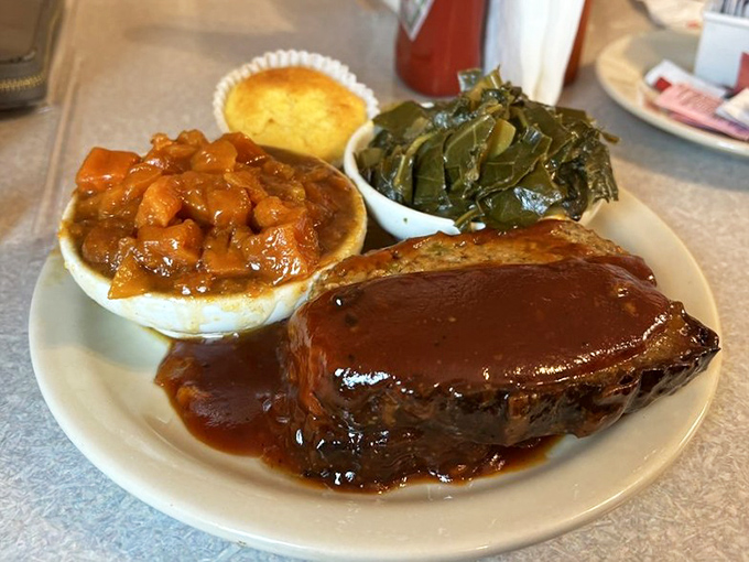 This isn't your mother's meatloaf&mdash;it's better. Hickory-smoked perfection swimming in house-made sauce with collards and candied yams.