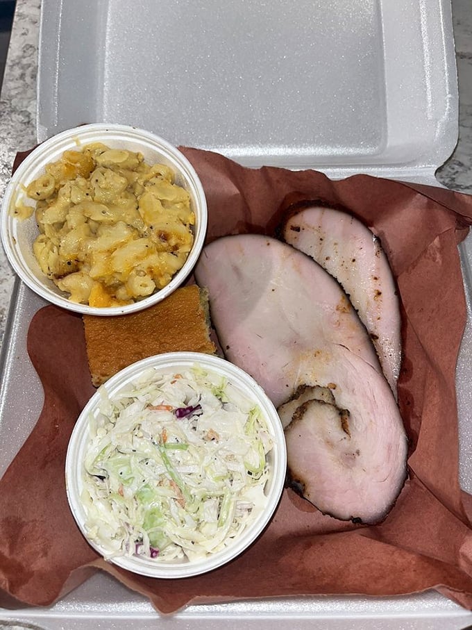 Behold the star of the show! Perfectly smoked turkey slices with mac and cheese and slaw &ndash; a trio that makes you wonder why turkey is relegated to just Thanksgiving.